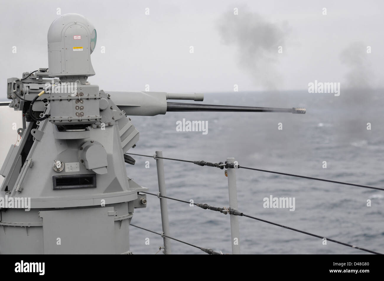 A 25mm gun is fired aboard USS Blue Ridge Stock Photo - Alamy