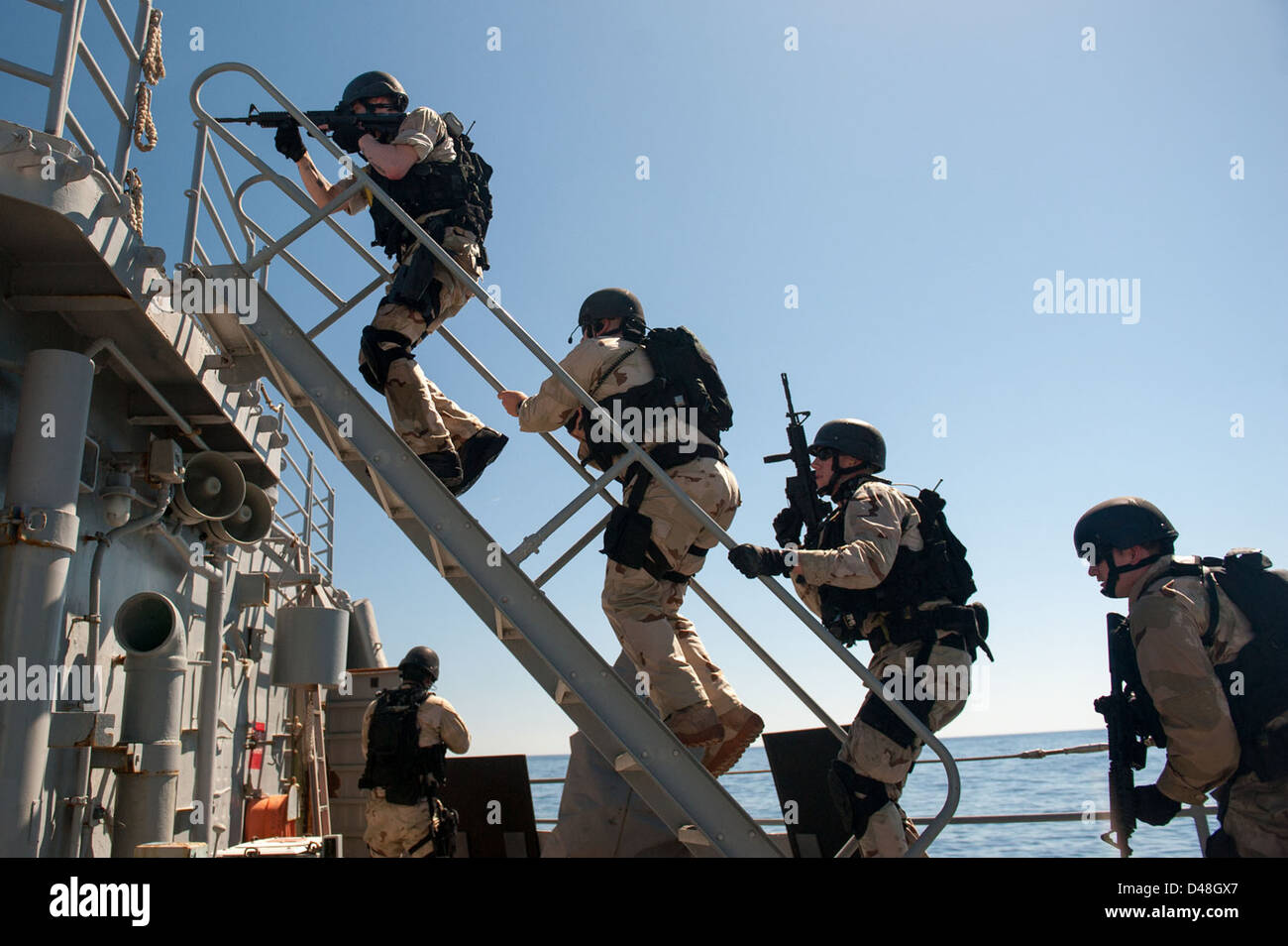 U.S. Navy sailors conduct a Visit, Board, Search, and Seizure (VBSS ...