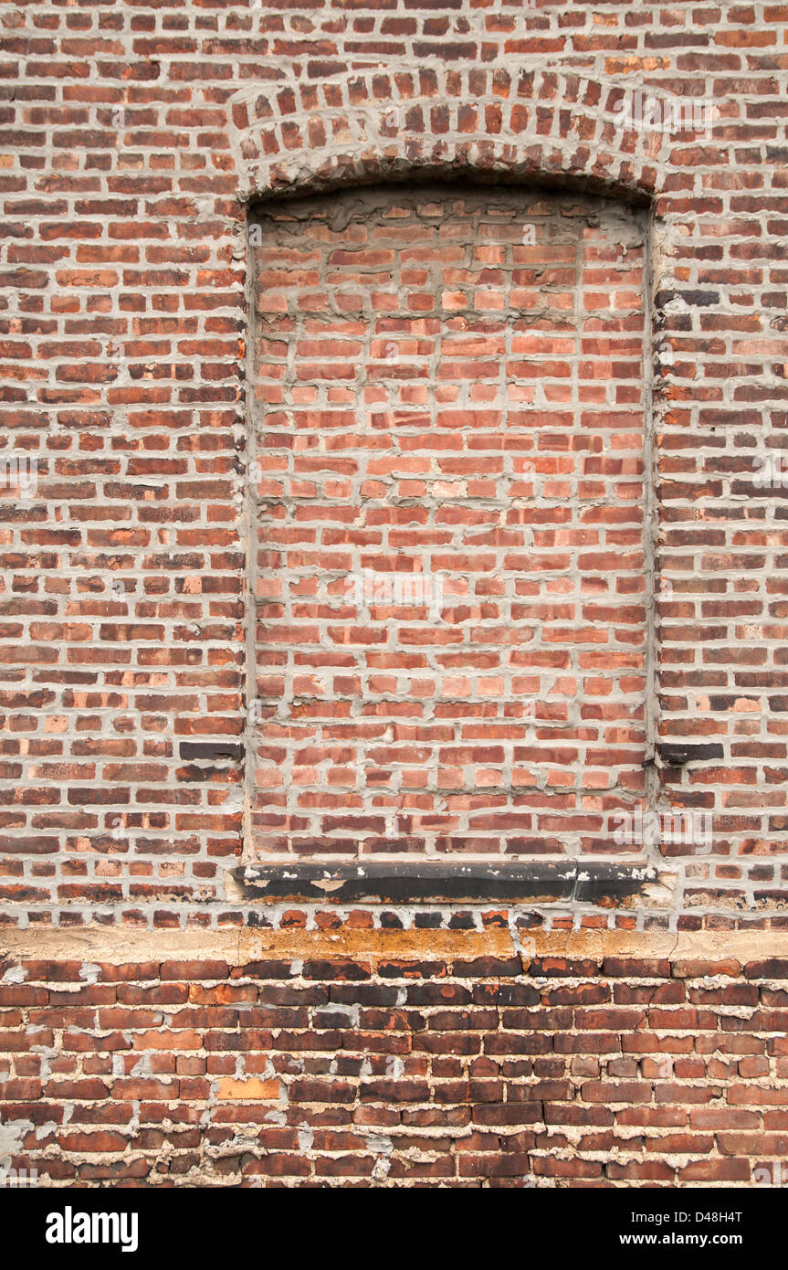 Wall with bricked up window Stock Photo - Alamy
