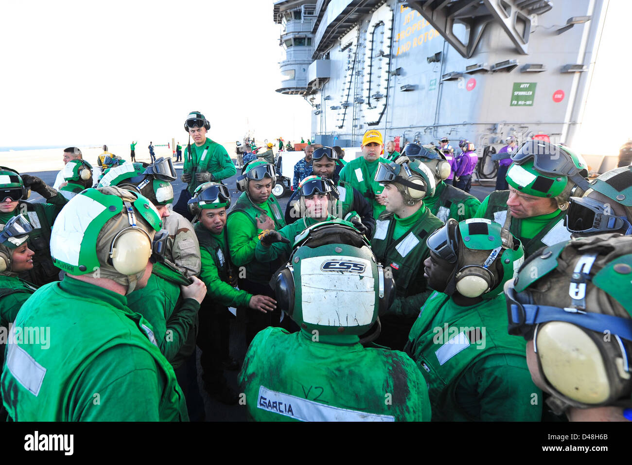 Sailors aboard USS Carl Vinson assemble on the flight deck, showcasing ...