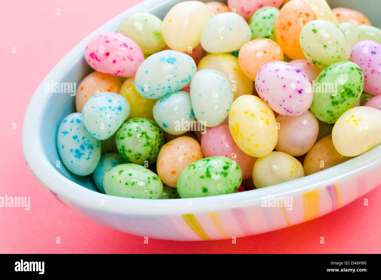 Assorted jelly beans in pastel colors with darker spots Stock Photo - Alamy