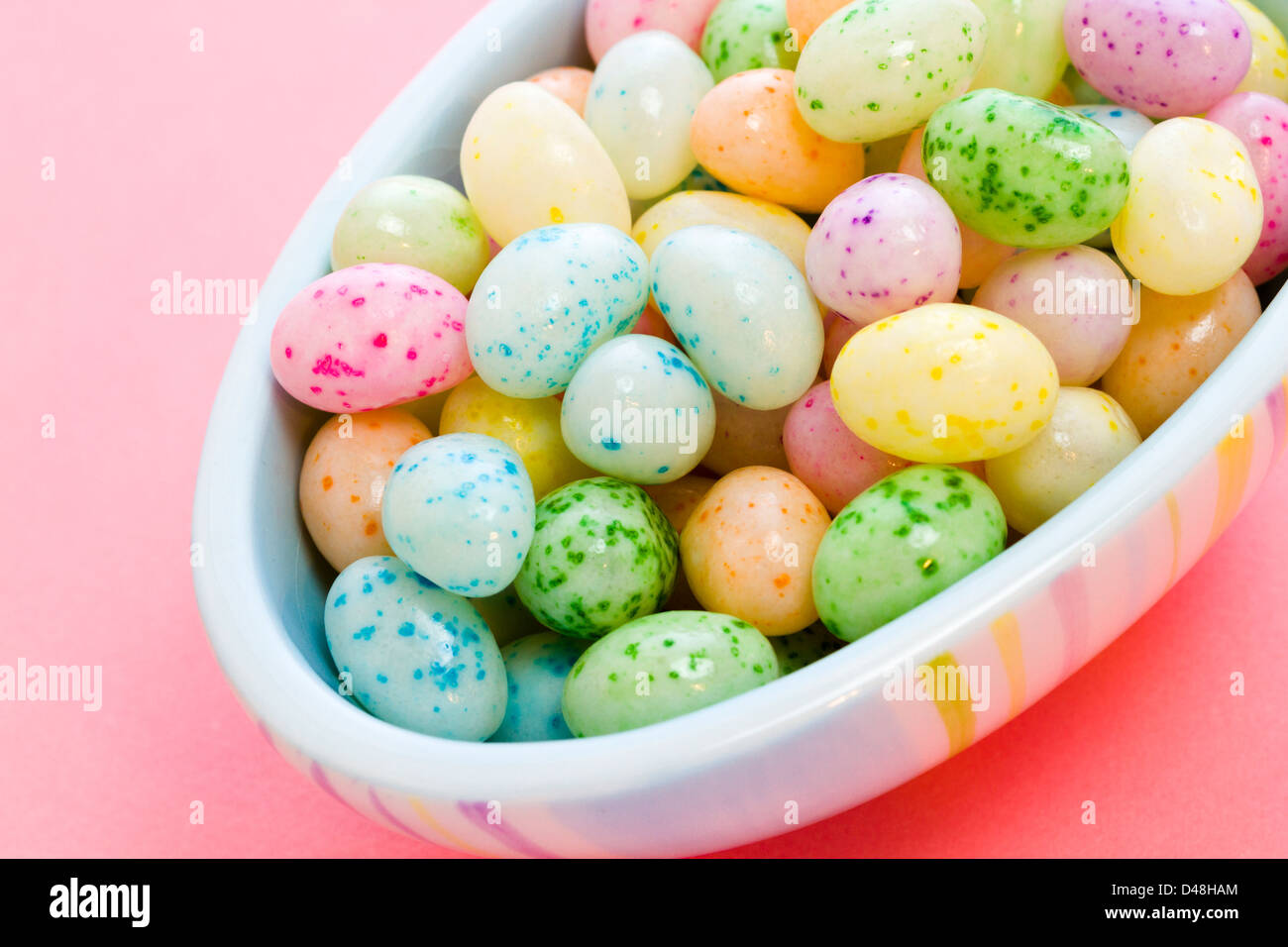 Assorted jelly beans in pastel colors with darker spots Stock Photo - Alamy