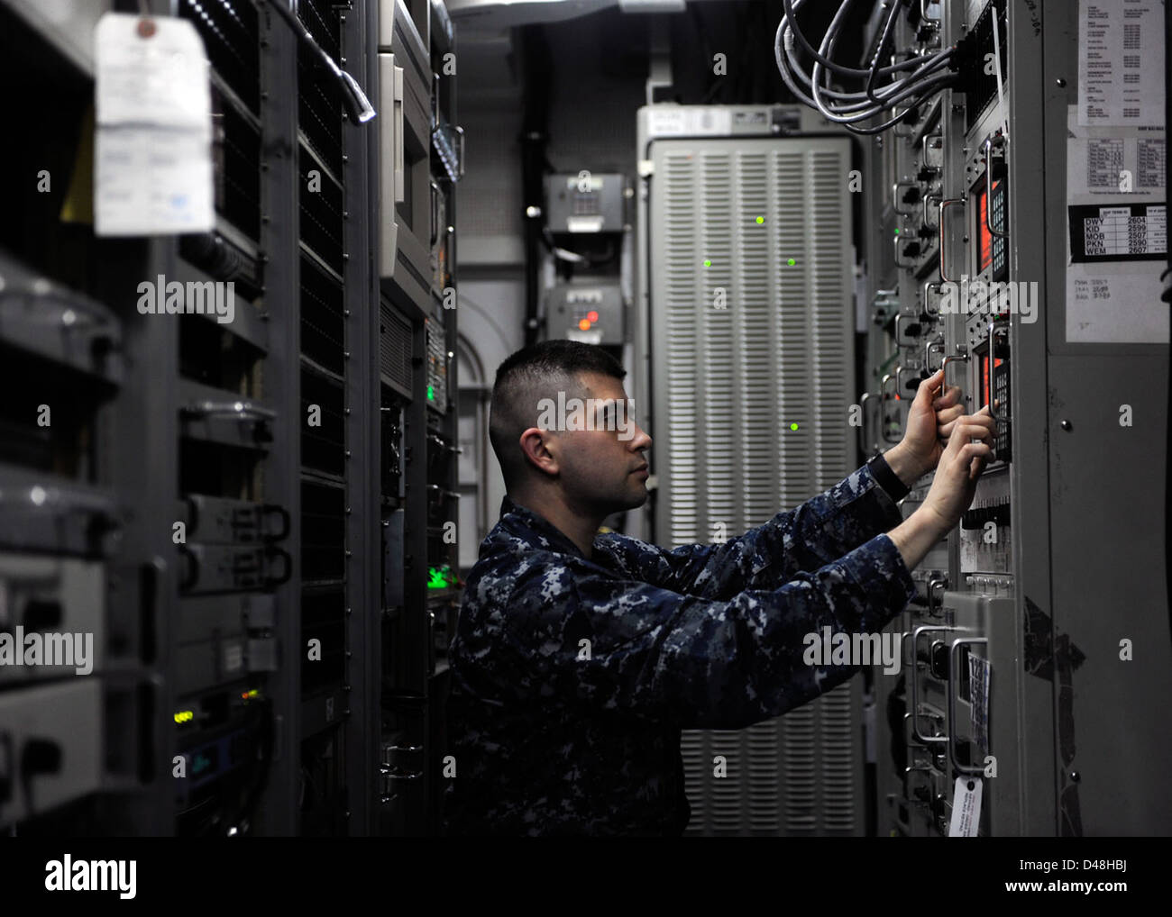 A U.S. Navy Sailor checks the emissions aboard the USS John C. Stennis ...