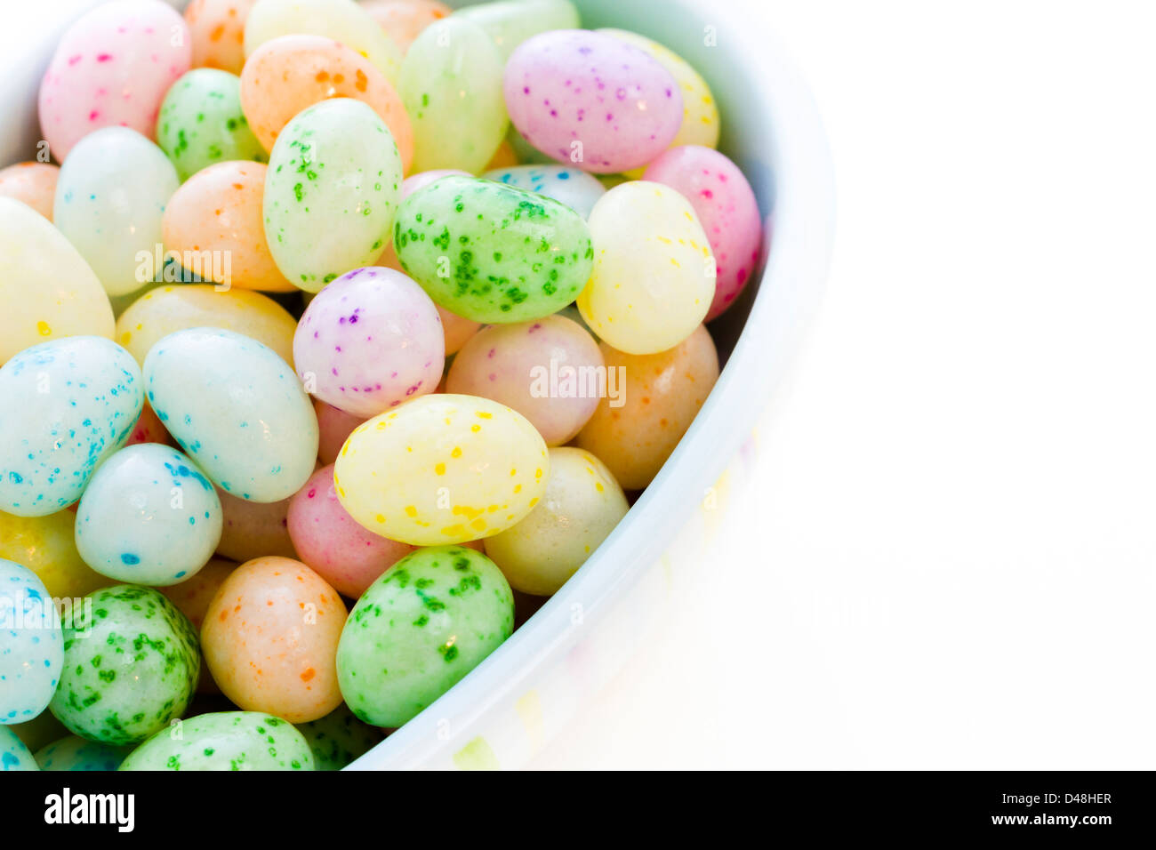 Assorted jelly beans in pastel colors with darker spots Stock Photo - Alamy