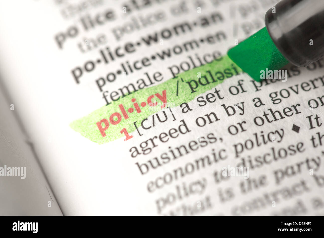 Policy definition highlighted in green hi-res stock photography and ...