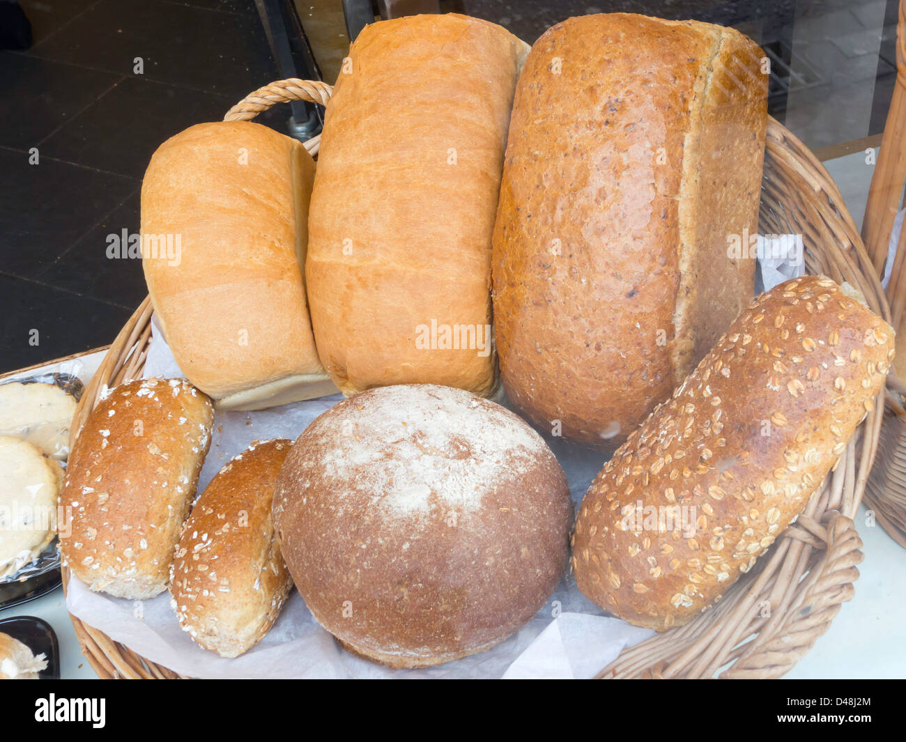 Freshly baked bread by a small local baker in a shop window Stock Photo ...