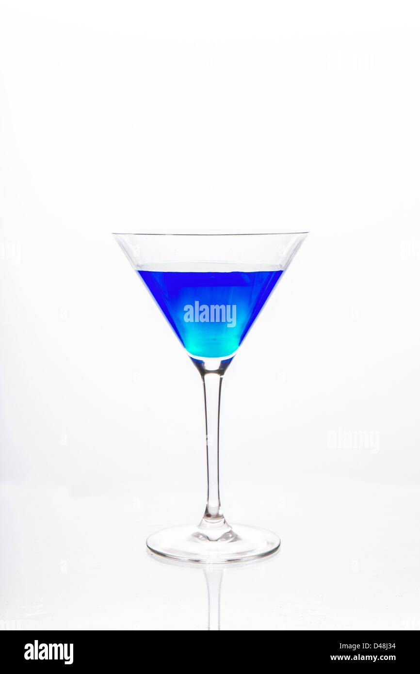 Cocktail glass with blue alcohol Stock Photo - Alamy
