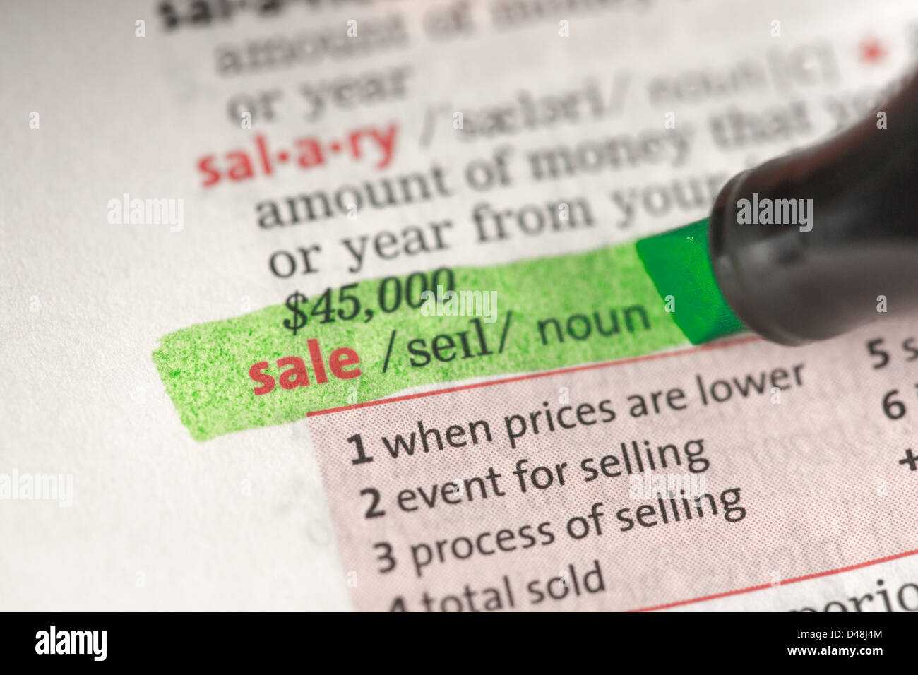 Sale definition highlighted in green Stock Photo - Alamy