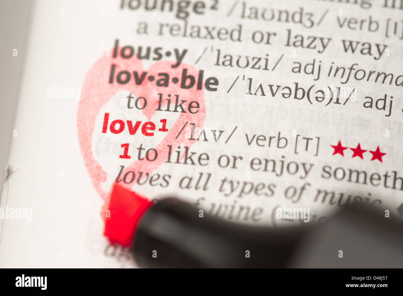 Love definition circled with a red heart Stock Photo - Alamy