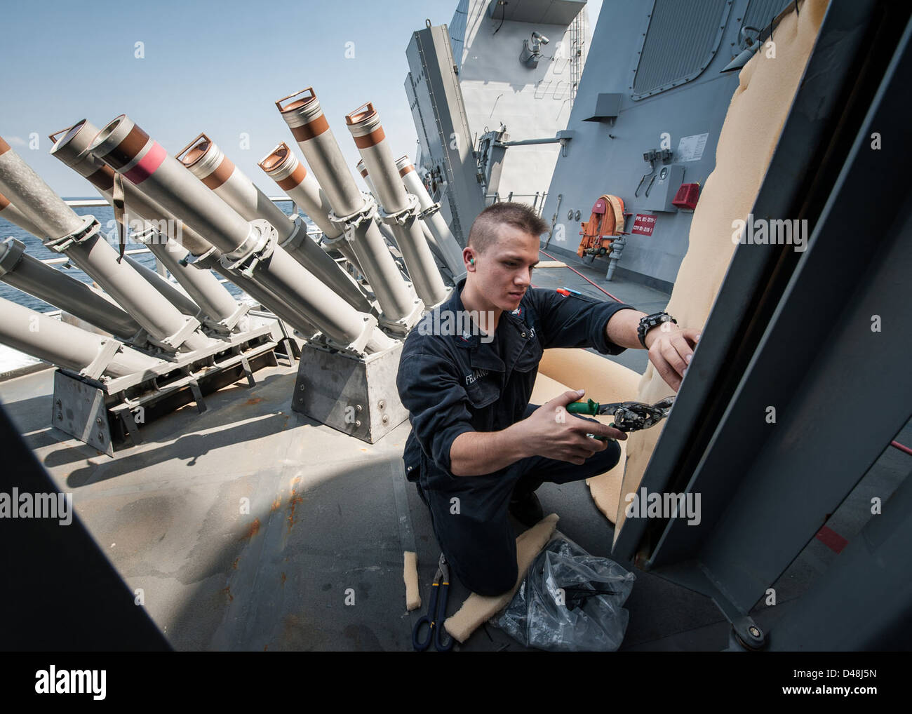 A Sailor performs duties aboard the USS Stockdale, supporting Navy ...