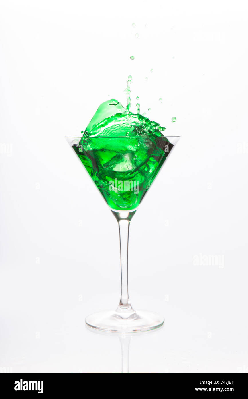 Cocktail glass with green alcohol Stock Photo - Alamy