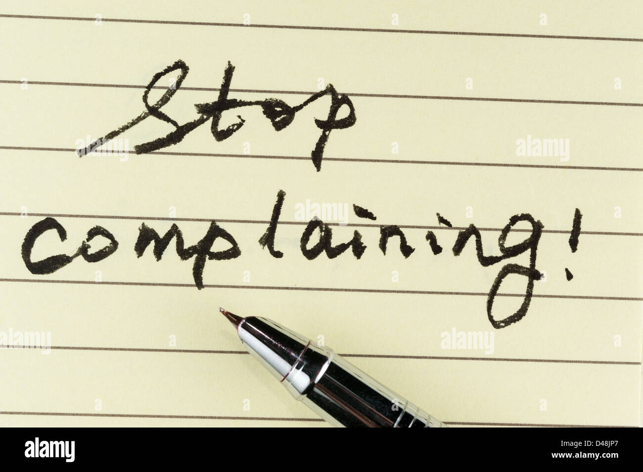 Stop complaining words written on lined paper with a pen on it Stock ...