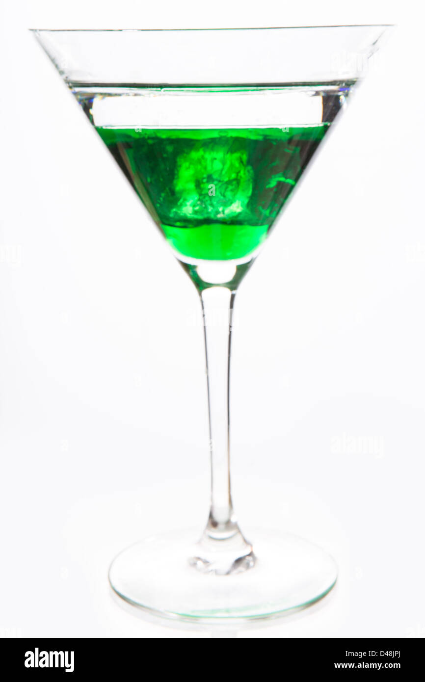 Cocktail glass with green alcohol close up Stock Photo - Alamy