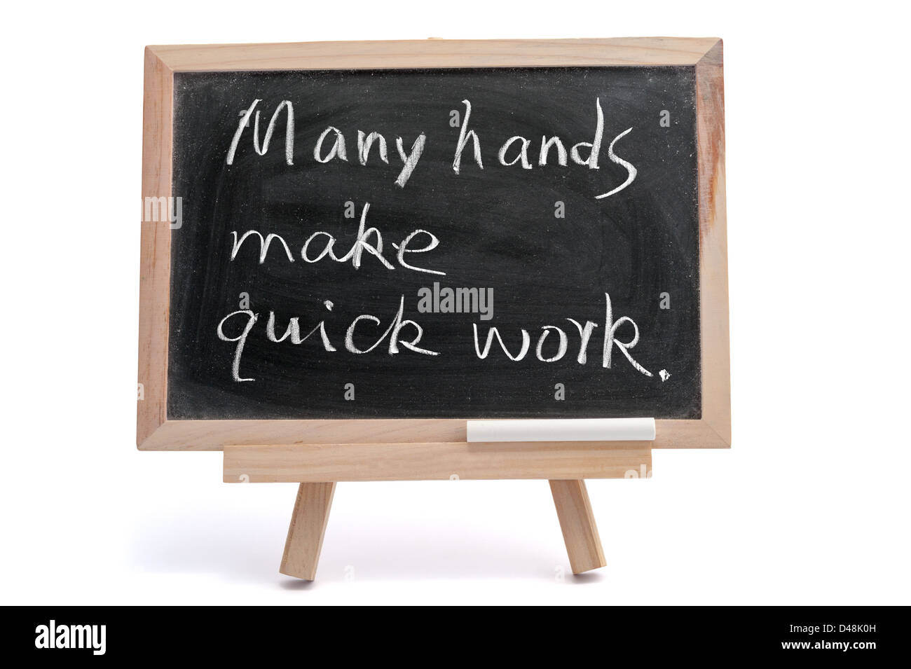 "Many hands make quick work" saying written on blackboard over white ...