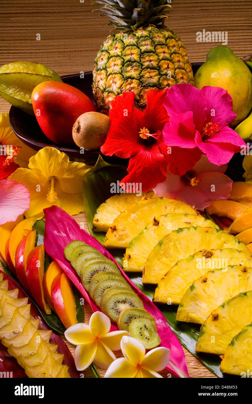 Studio Shot Of A Variety Of Tropical Fruit, Whole And Cut Into Slices ...