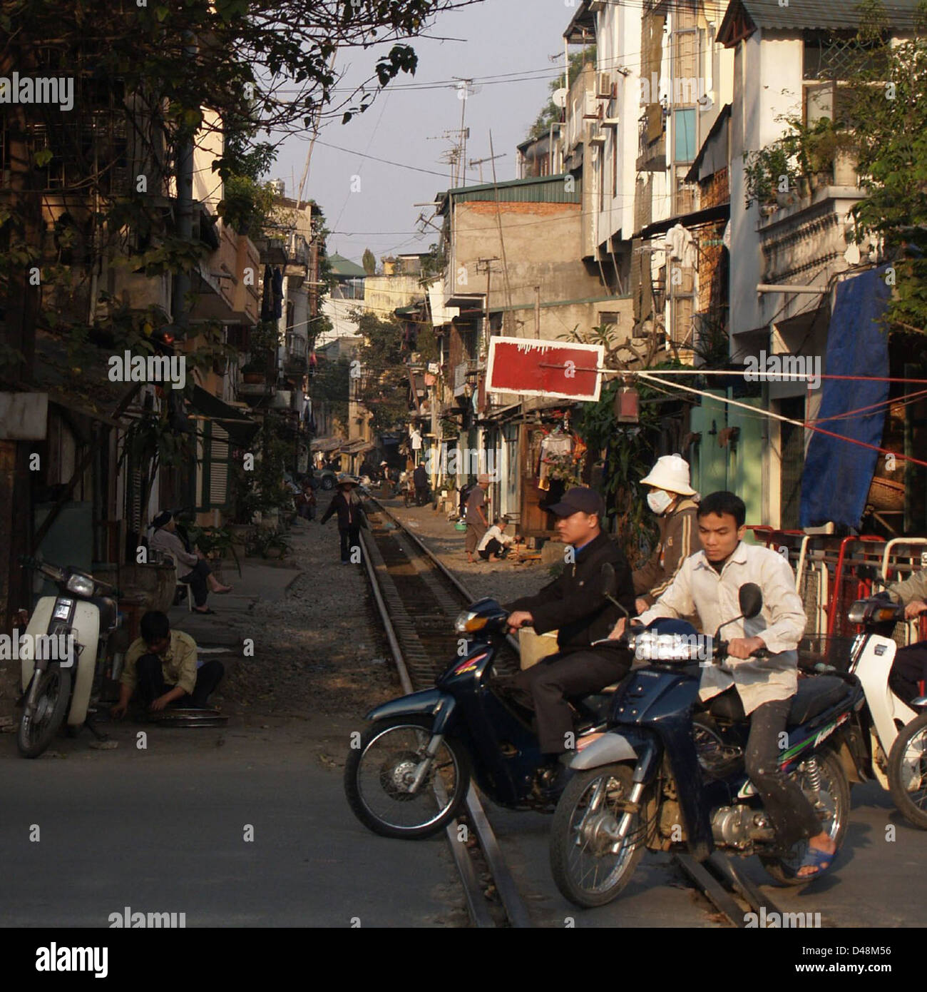 The image captures the railway tracks and surrounding traffic, focusing ...