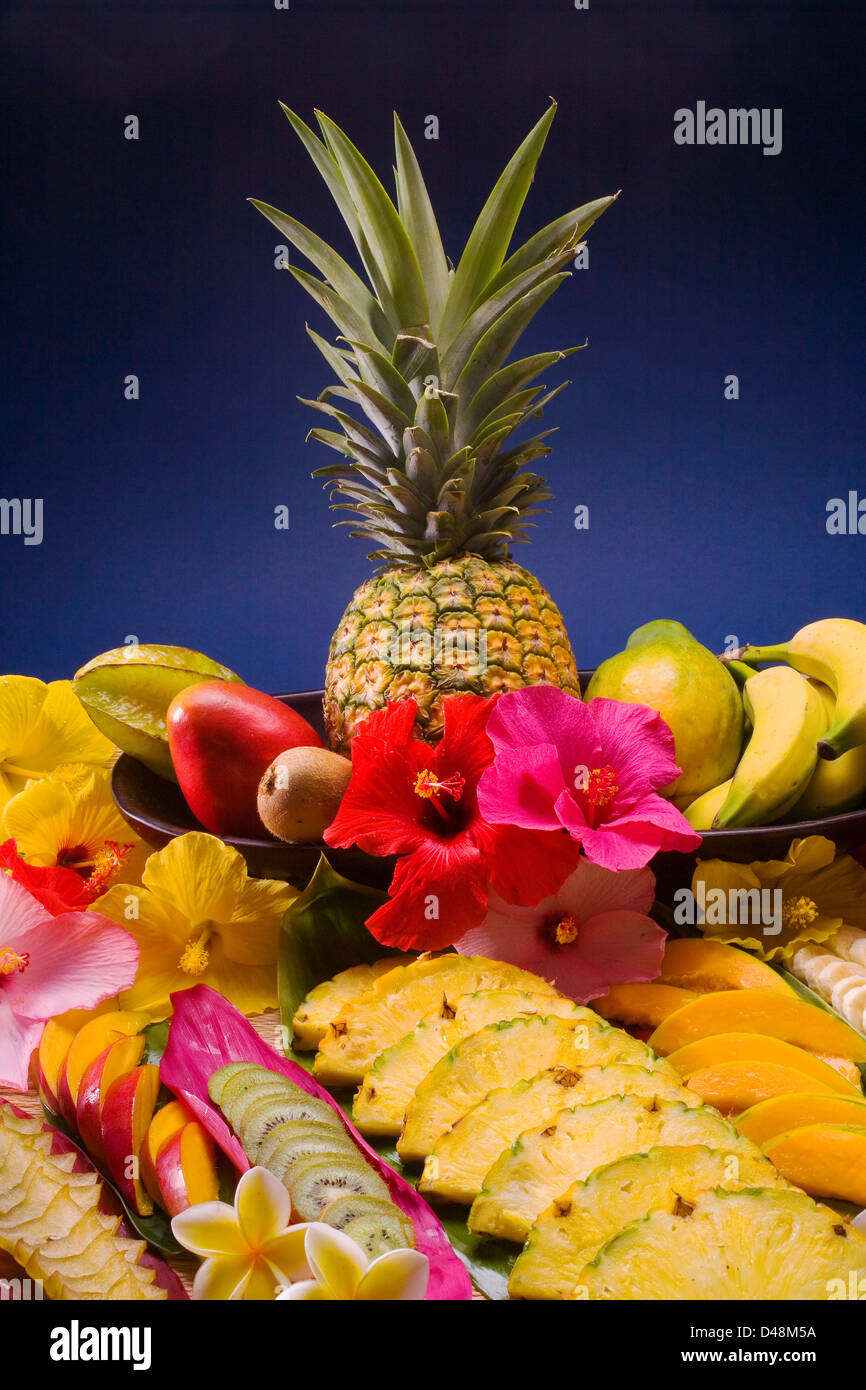 Studio Shot Of A Variety Of Tropical Fruit, Whole And Cut Into Slices ...