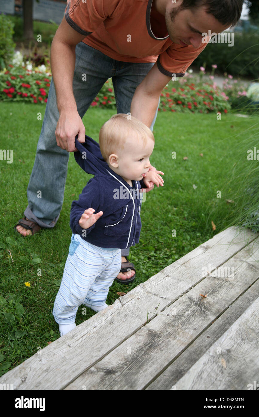 Father teaching child walk hi-res stock photography and images - Alamy