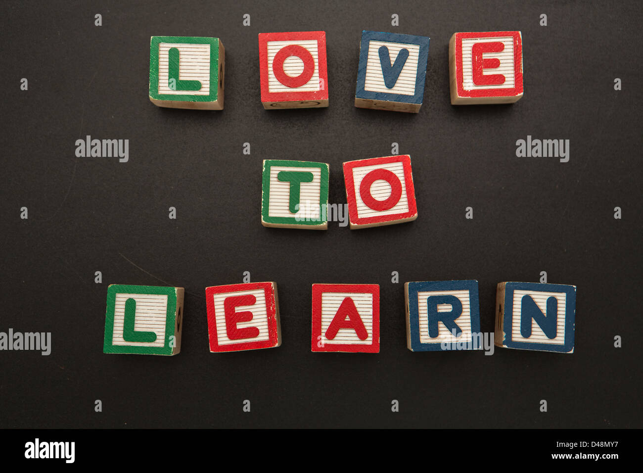 Love to learn message in wooden blocks Stock Photo - Alamy