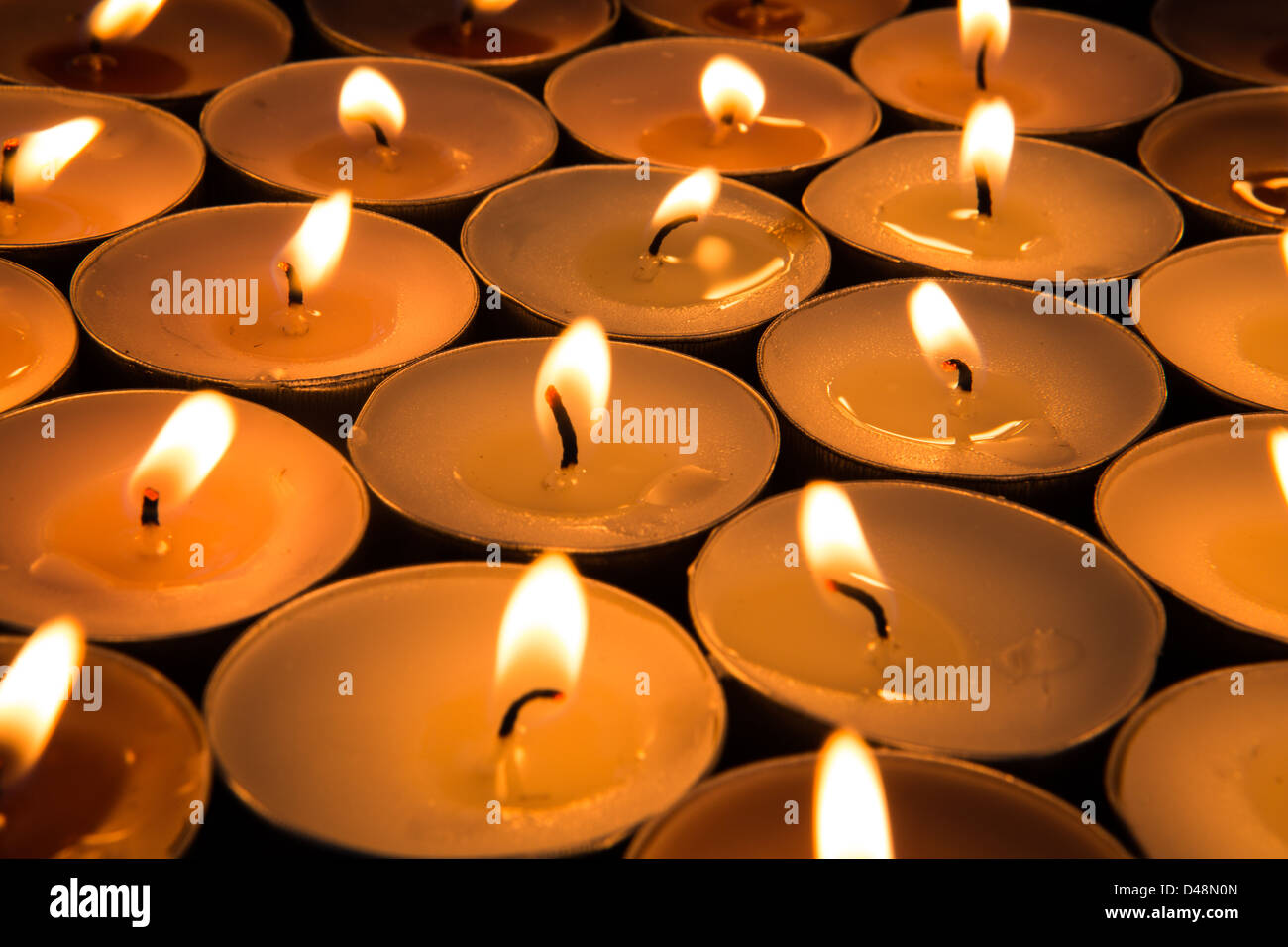 Many candles burning Stock Photo - Alamy