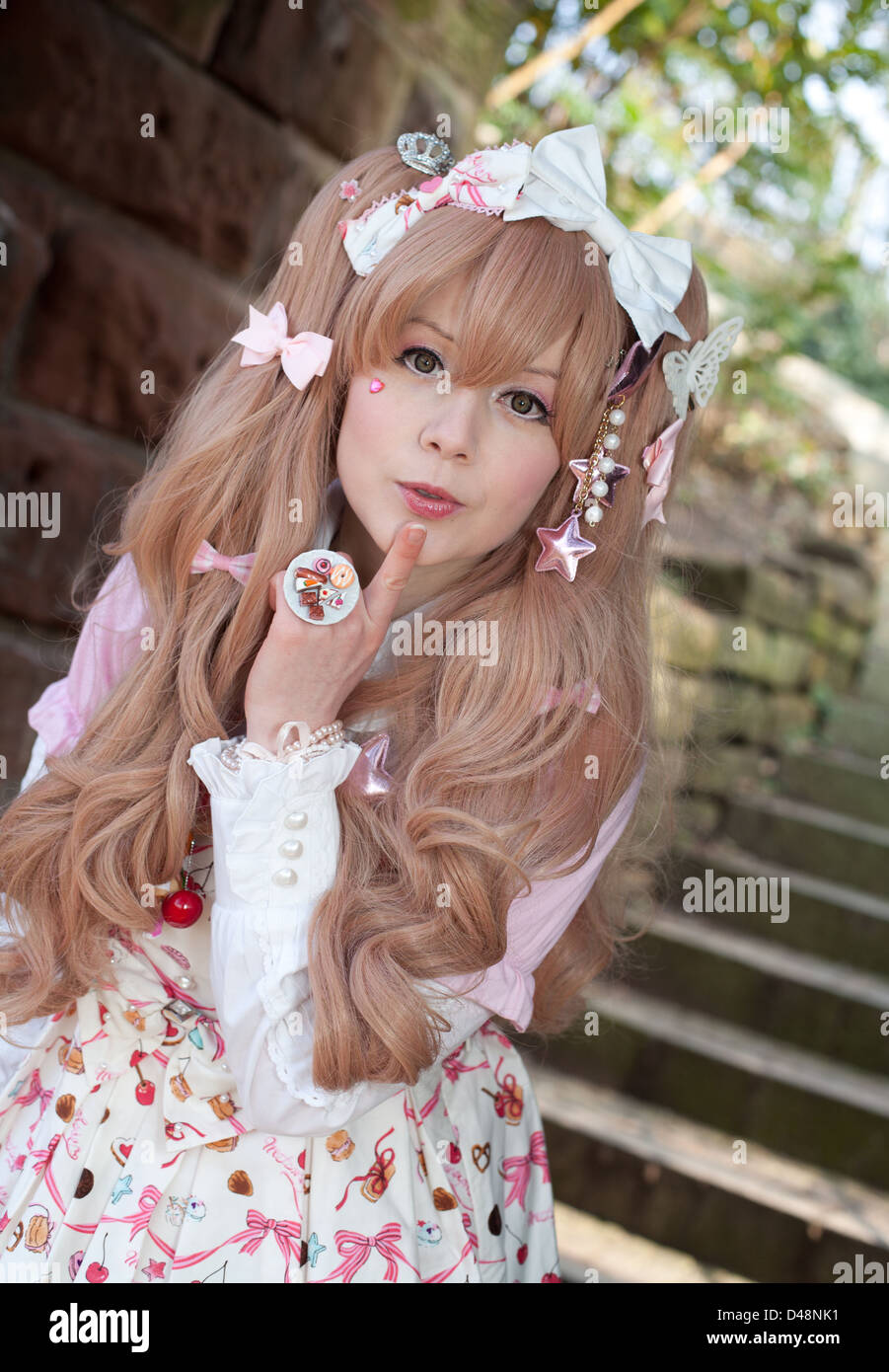 Female model in Cosplay Lolita Clothes outdoors near steps Stock Photo ...