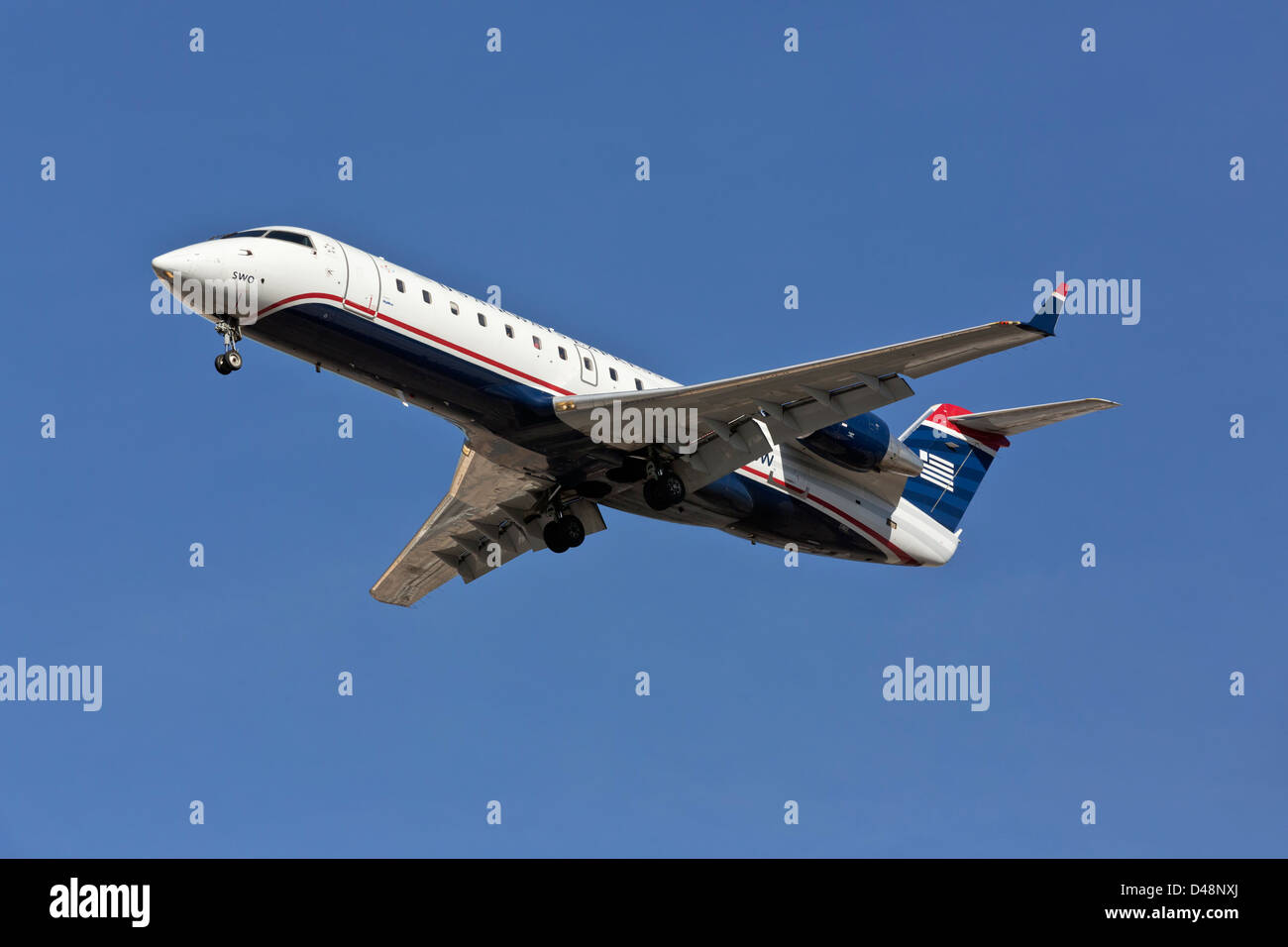 A Bombardier Challenger CRJ of US Airways on final approach Stock Photo ...