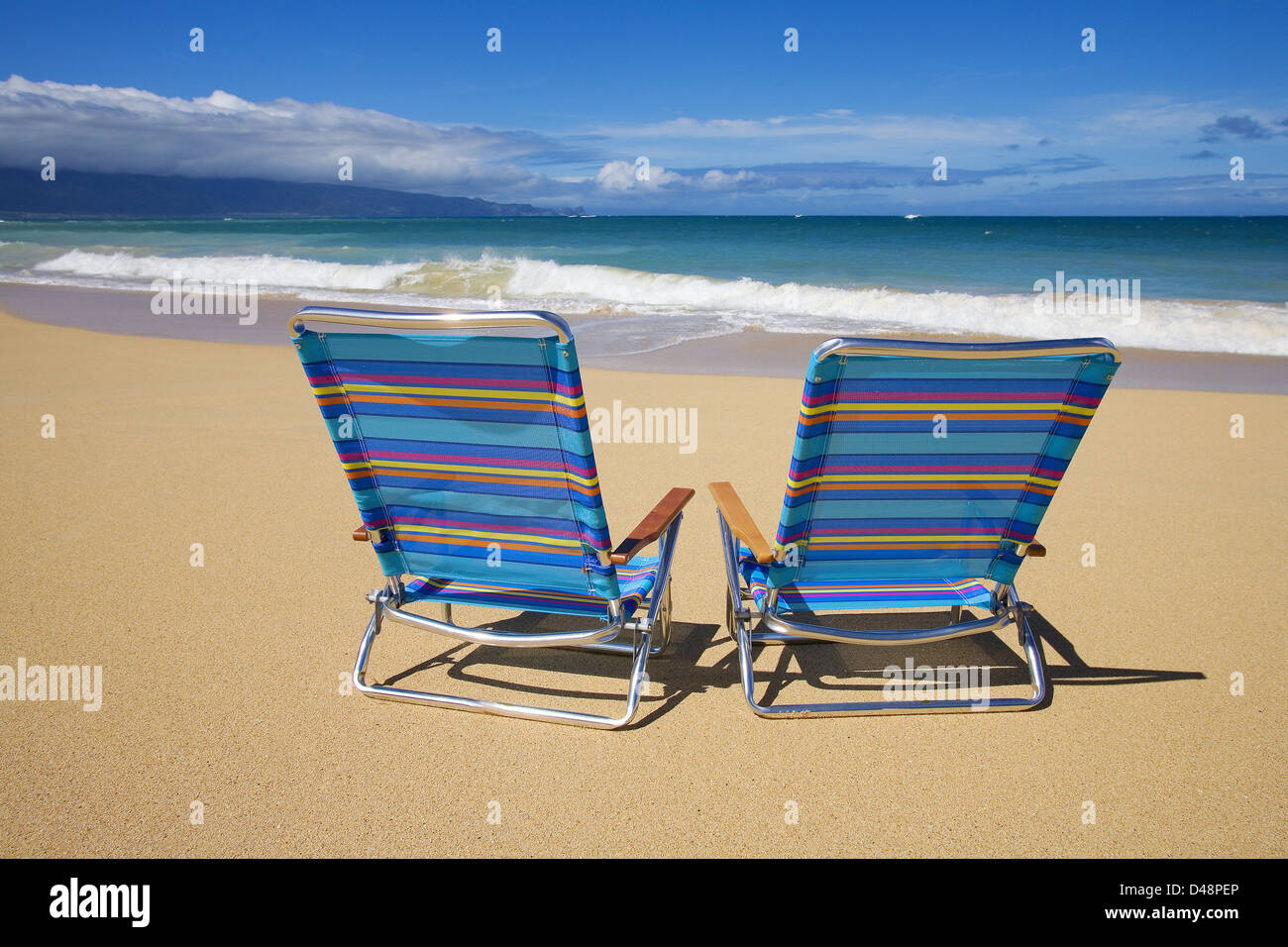 Brightly Colored Beach Chairs On The Sand Near The Ocean Stock Photo ...