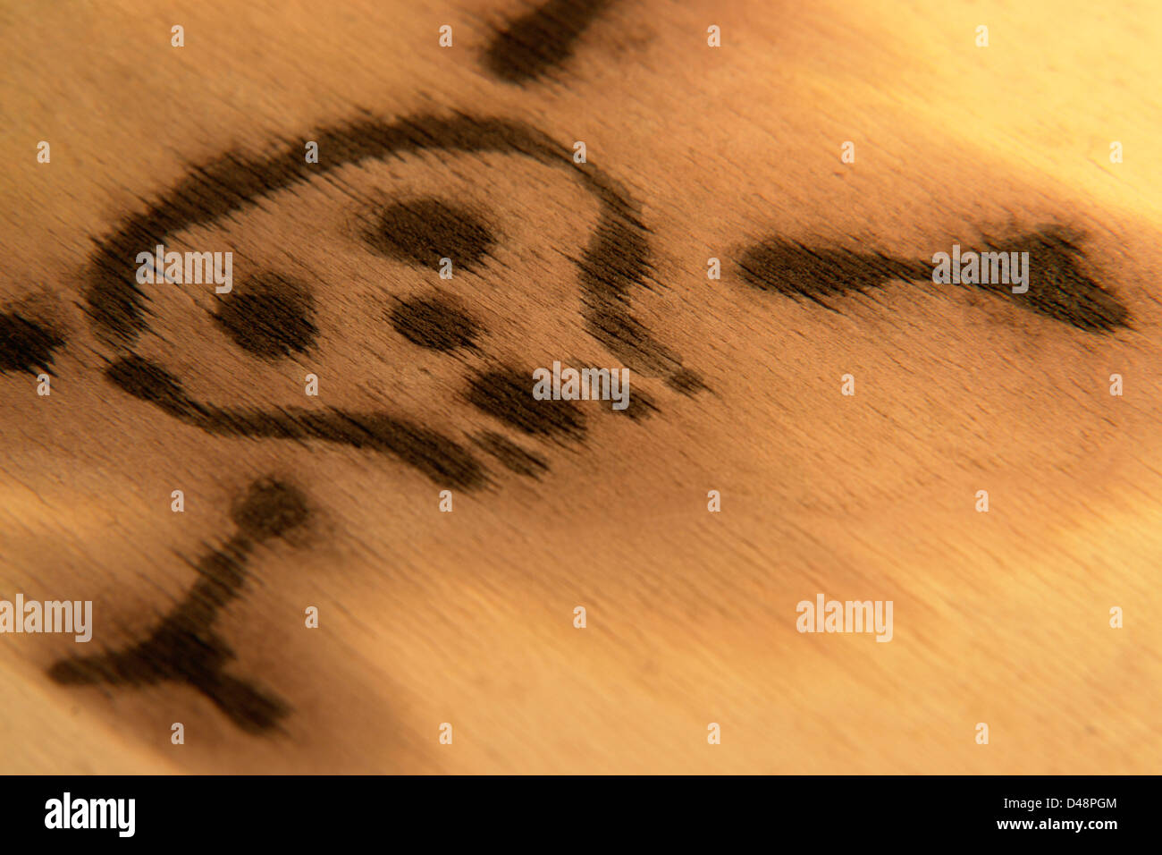 detail of a symbolic skull wich is painted with acid on wood Stock ...