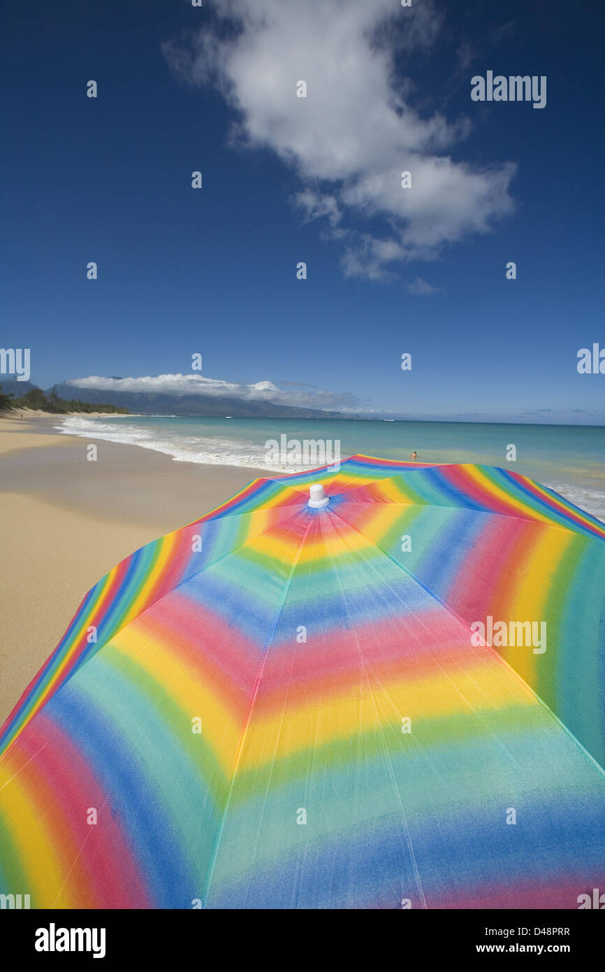 Brightly Colored Beach Umbrella On The Sand Near The Ocean Stock Photo ...