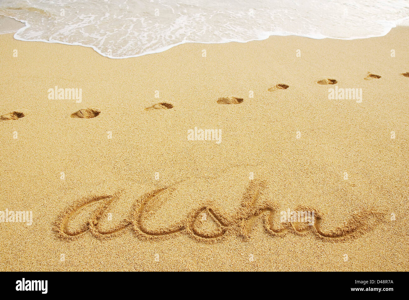 Aloha written in sand hawaiian hi-res stock photography and images - Alamy