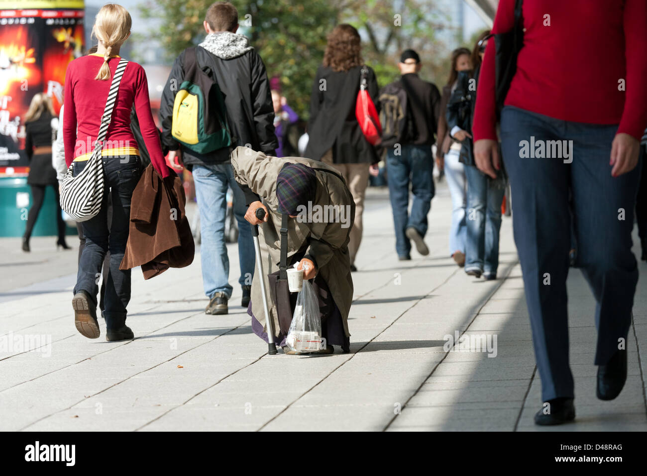 Beggar crutch hi-res stock photography and images - Alamy