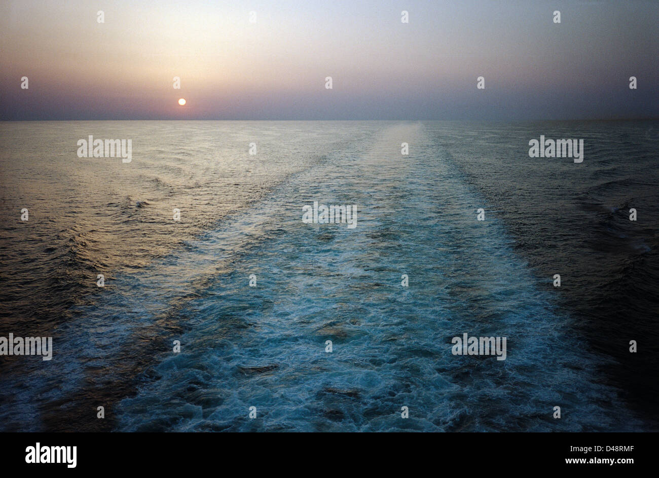Wake of ship, sunset, English Channel Stock Photo - Alamy