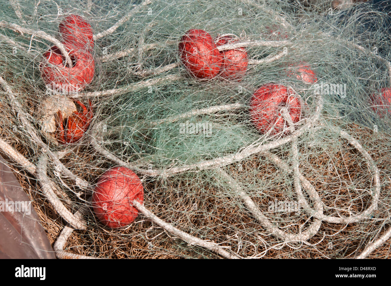 colored fishing net in a small harbor Stock Photo - Alamy