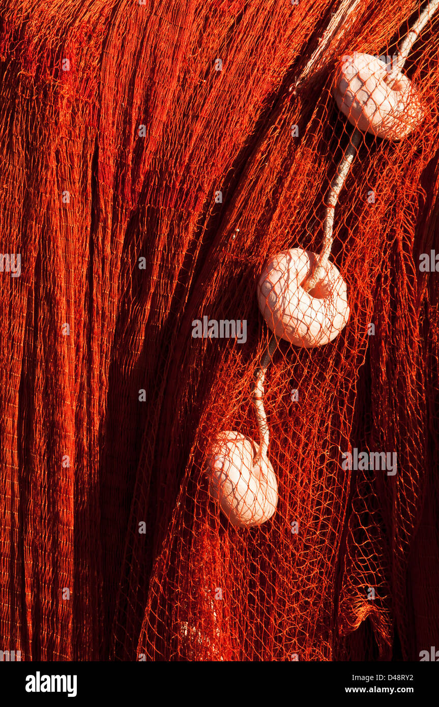 colored fishing net in a small harbor Stock Photo - Alamy