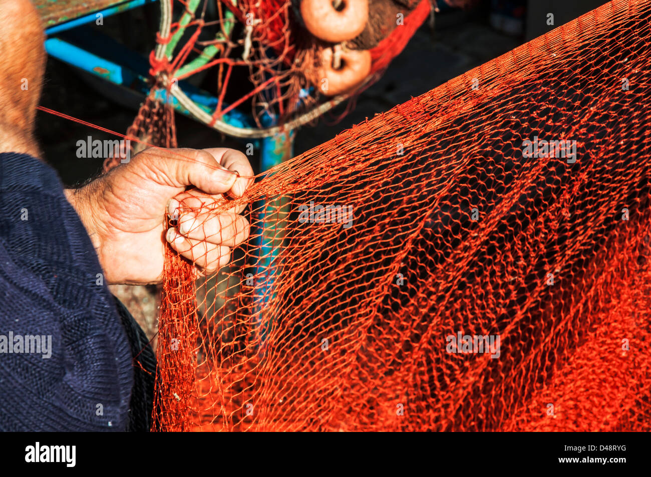 colored fishing net in a small harbor Stock Photo - Alamy