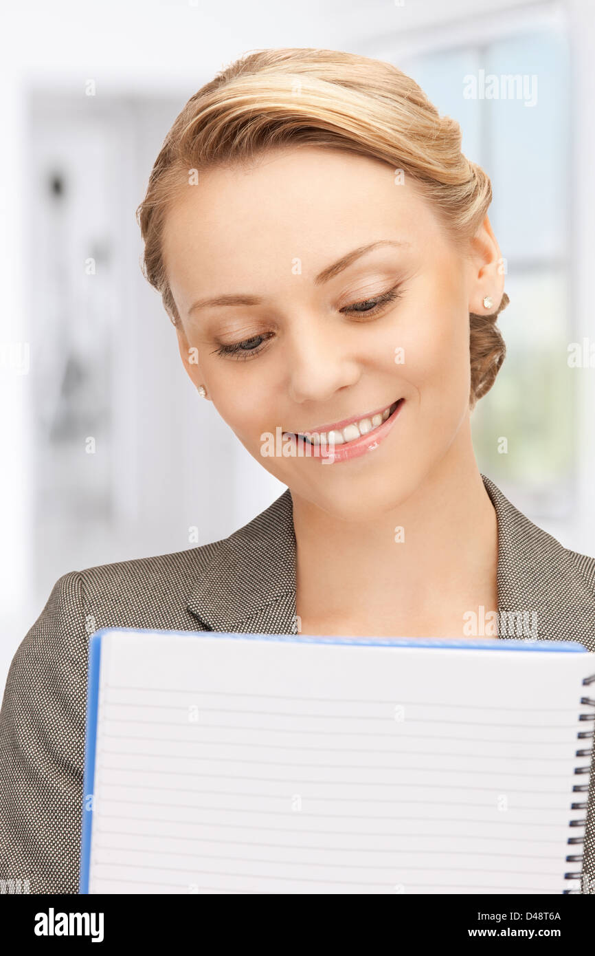 happy woman with big notepad Stock Photo - Alamy