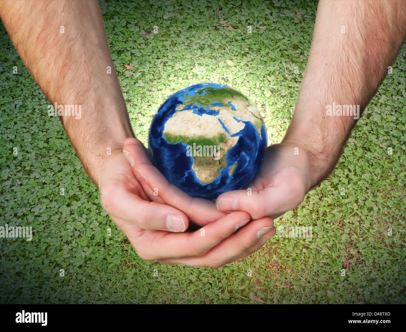 Arms holding whole world Stock Photo - Alamy