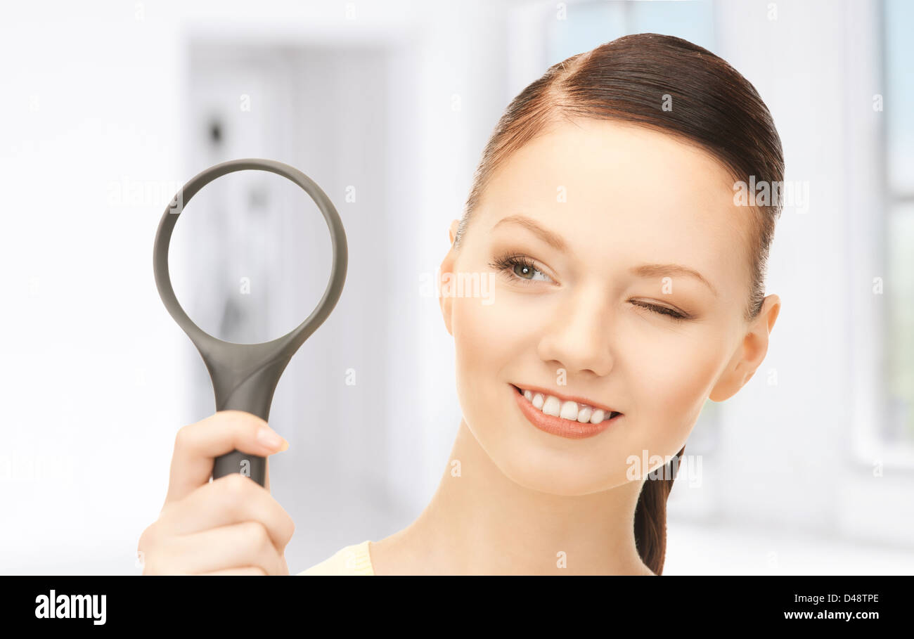 woman with magnifying glass Stock Photo - Alamy