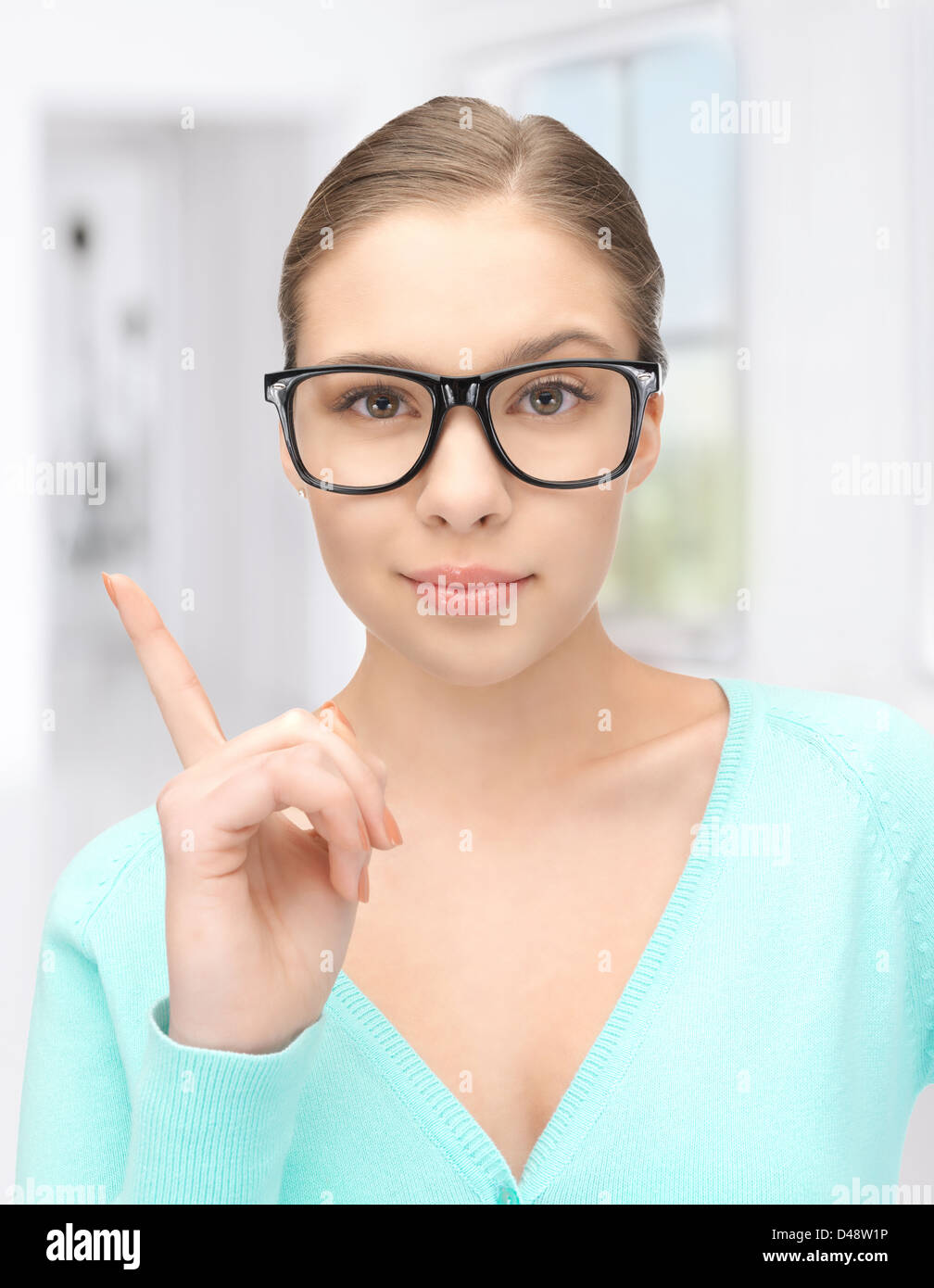 woman with her finger up Stock Photo - Alamy