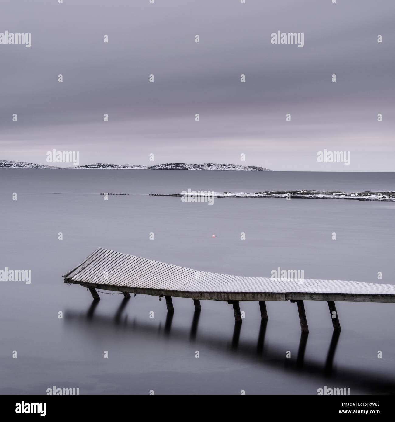 Frozen jetty over water in Asa, Kungsbacka Municipality, Halland County ...