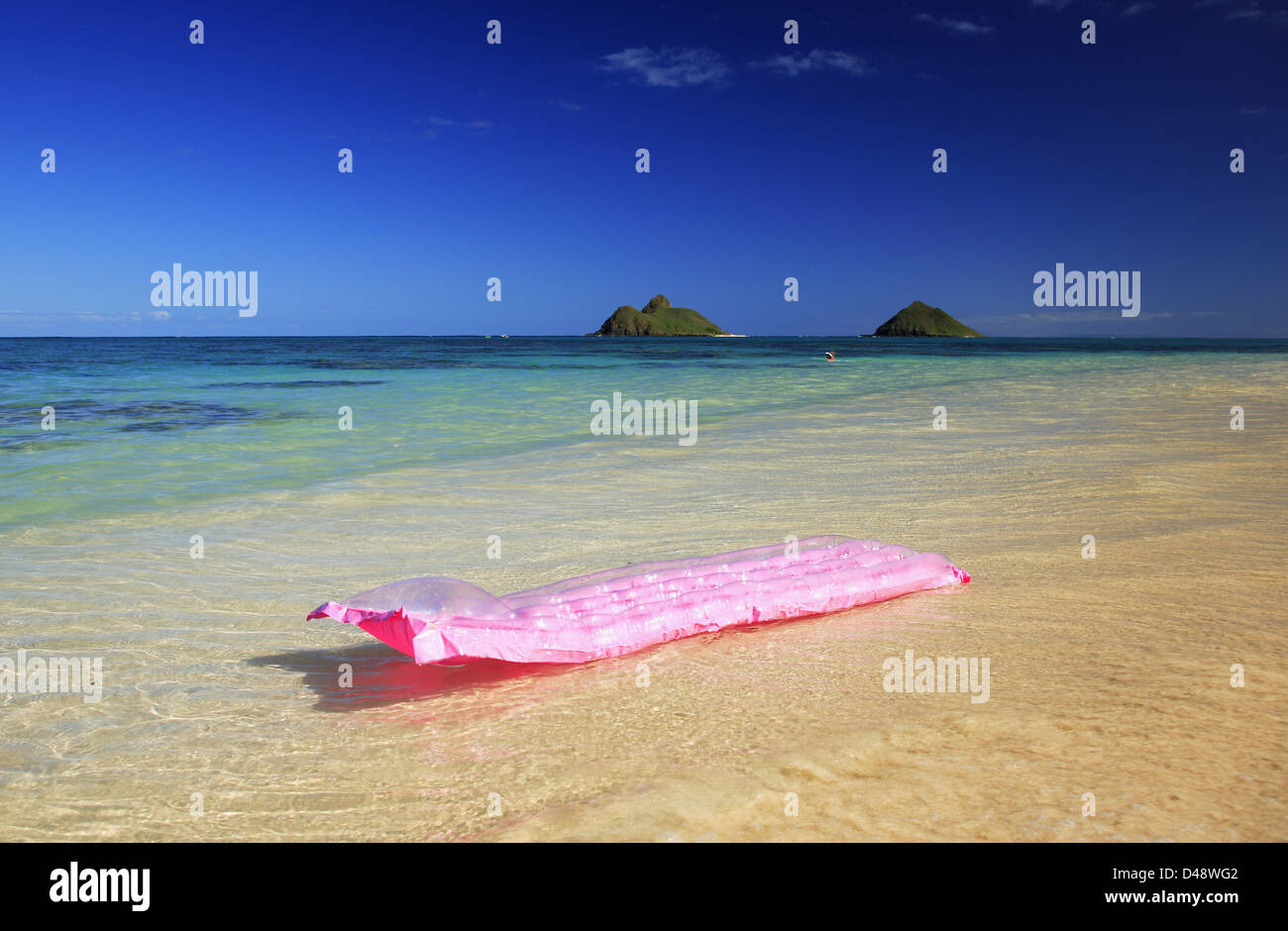 Hawaii, Oahu, Lanikai, Pink Inflated Raft On Clear Ocean Water, Mokulua ...