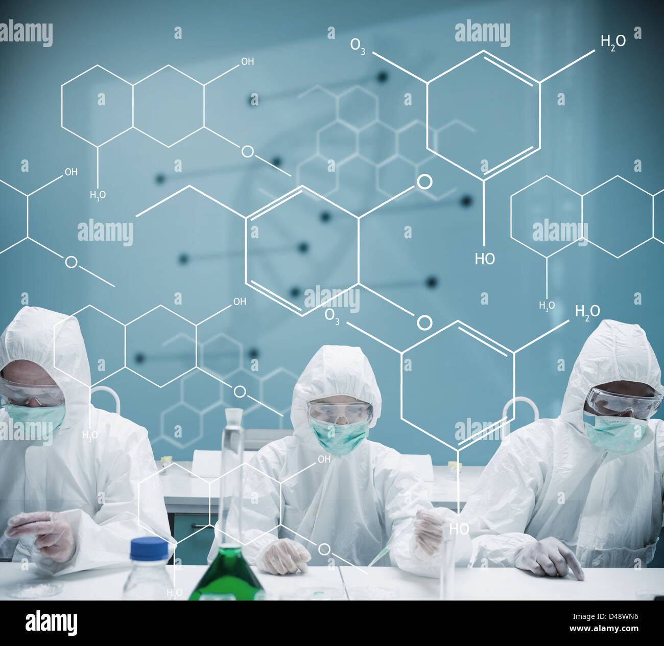 Chemists working in protective suit with futuristic interface showing ...