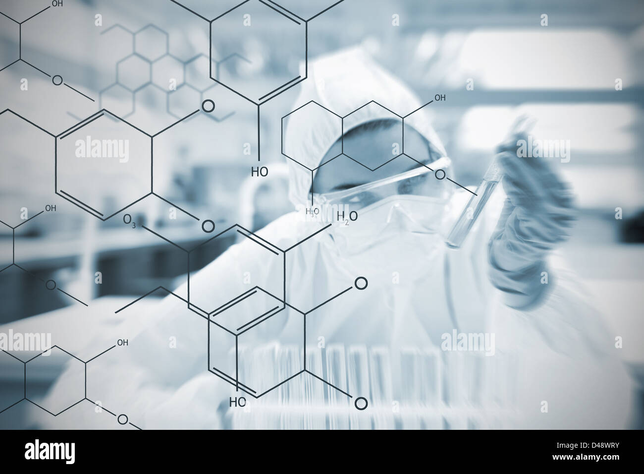 Chemist working cautiously with liquid and futuristic interface showing ...