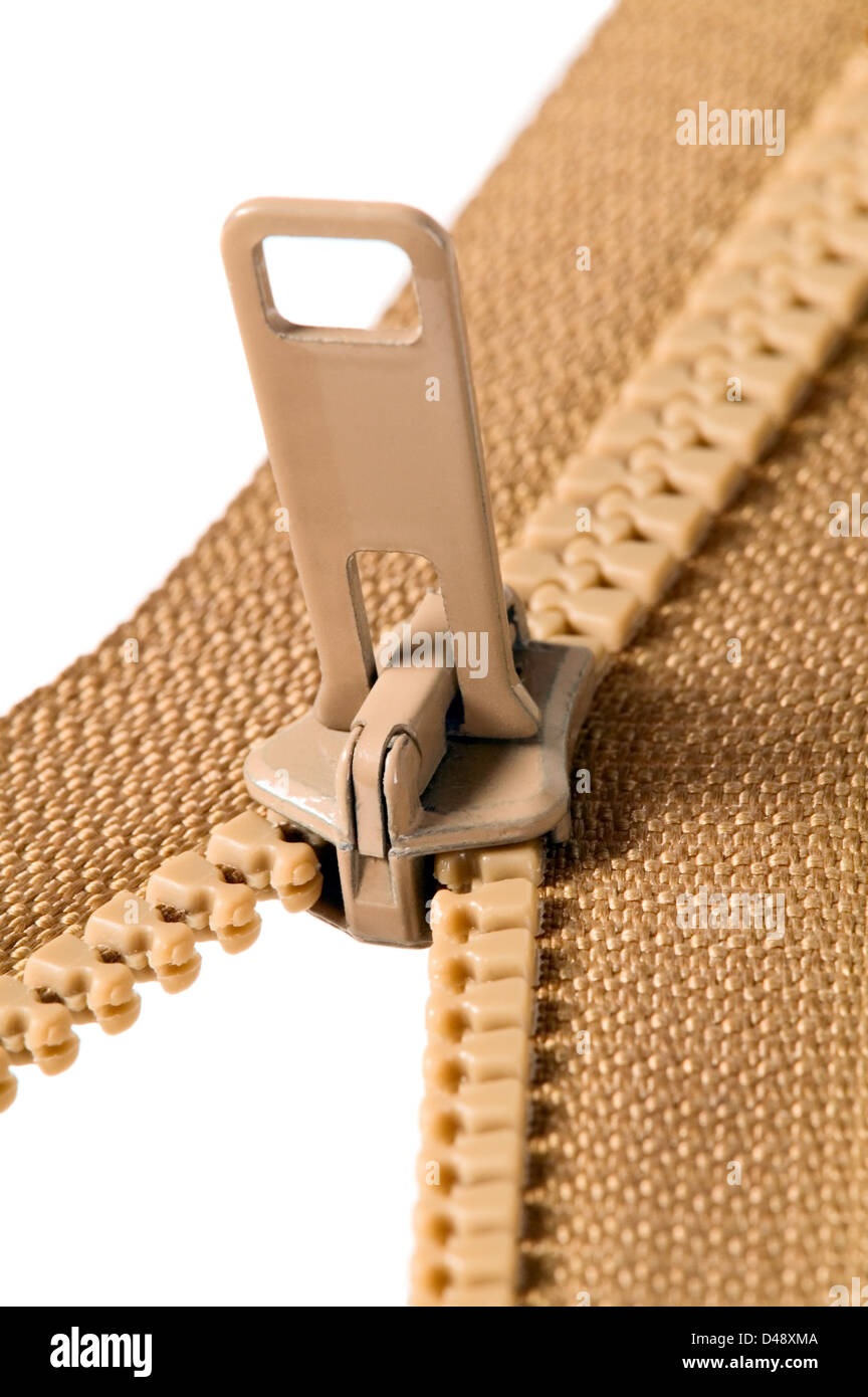 Brown zip with metal teeth, unzipped, clothing industry Stock Photo - Alamy