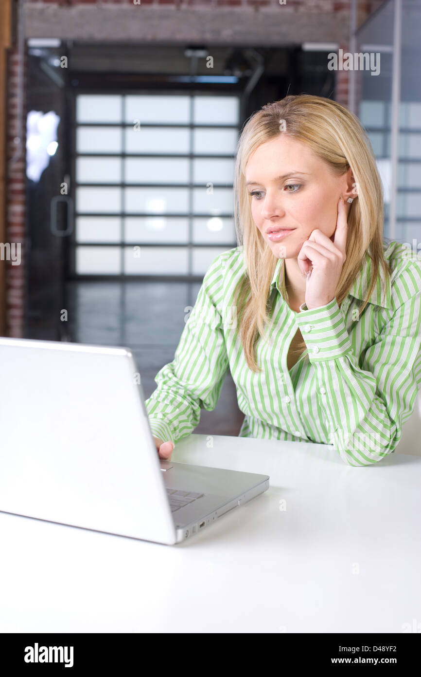 Business woman at her desk in a modern office Stock Photo - Alamy