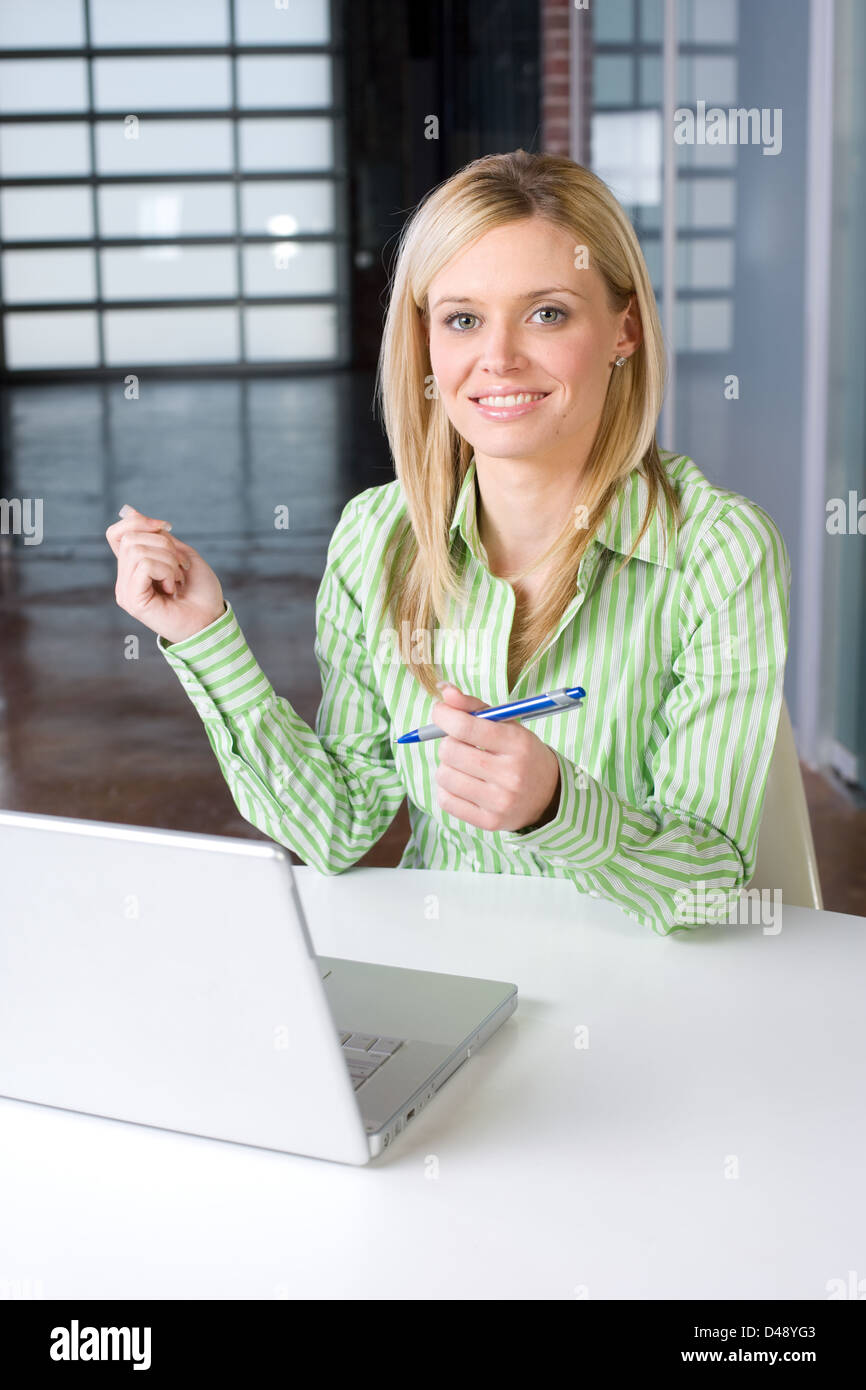 Business woman at her desk in a modern office Stock Photo - Alamy