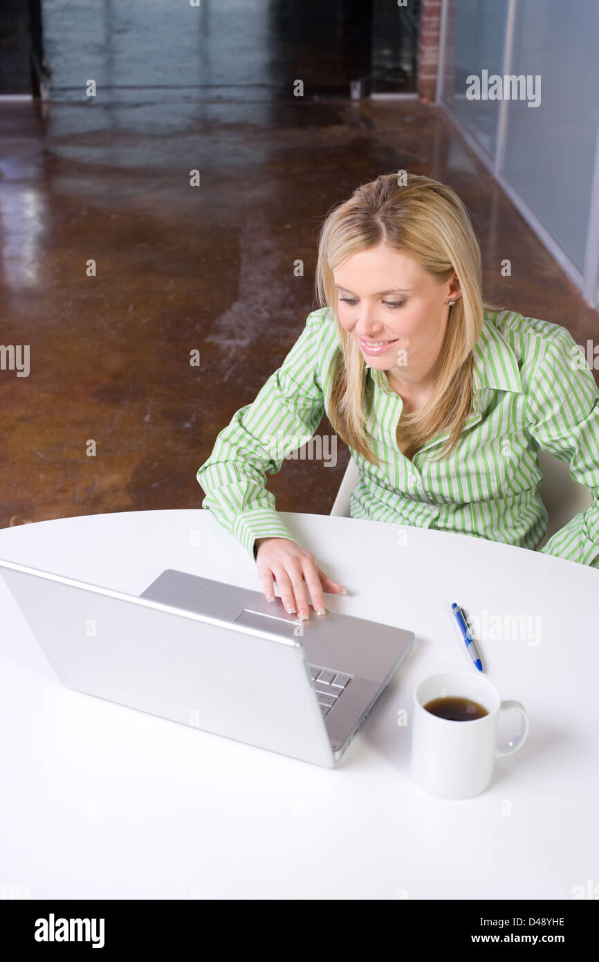 Business woman at her desk in a modern office Stock Photo - Alamy