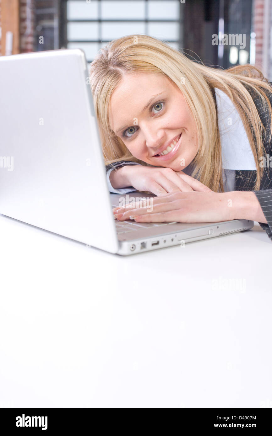 Business woman at her desk in a modern office Stock Photo - Alamy