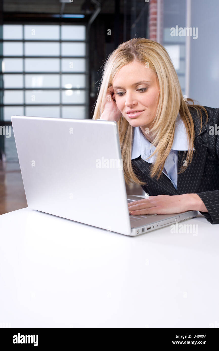 Business woman at her desk in a modern office Stock Photo - Alamy