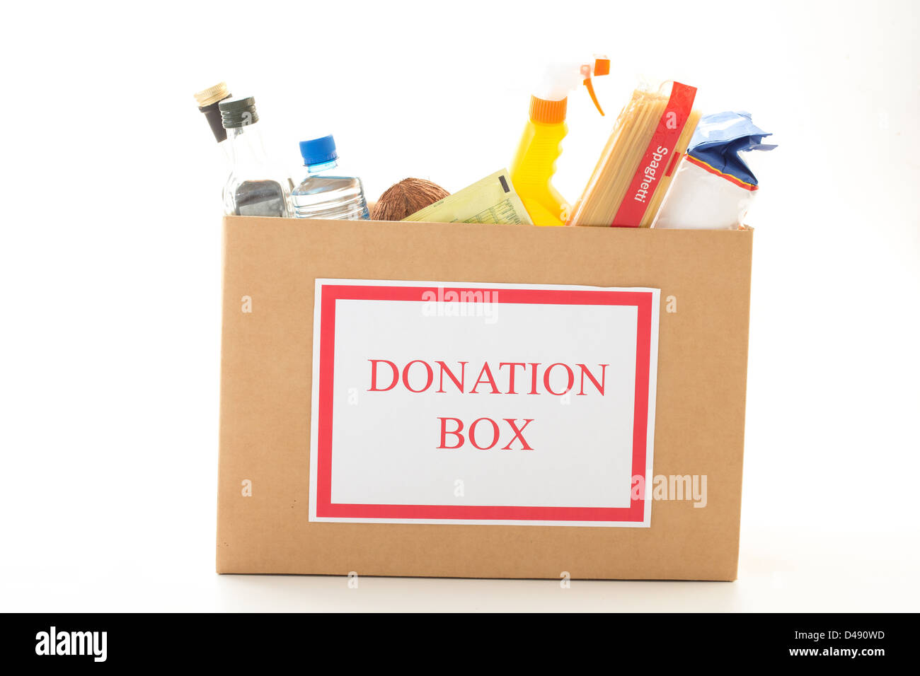 Cardboard donation box with houseware product and food Stock Photo - Alamy